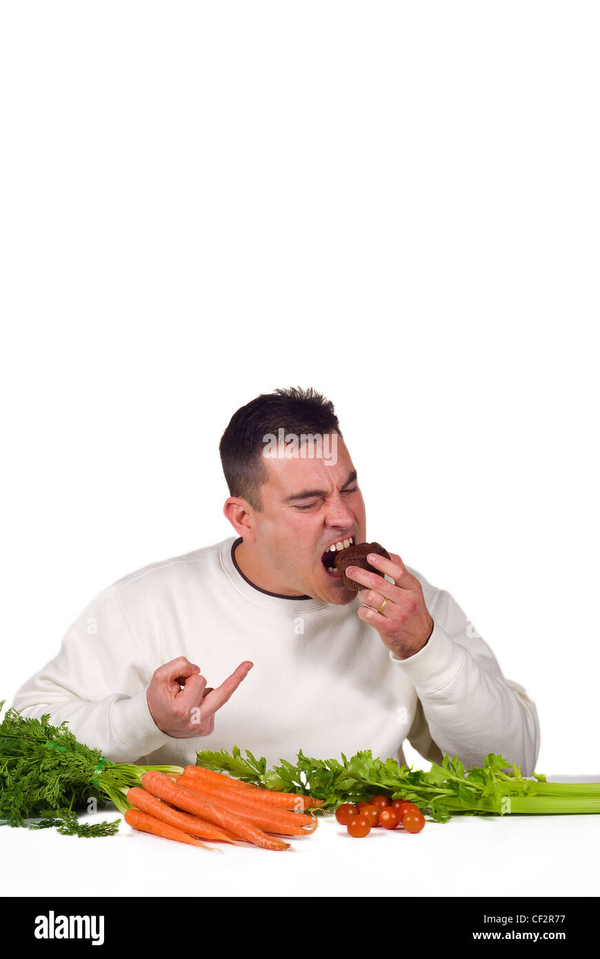 Guy completely fed up with his vegetables Stock Photo - Alamy
