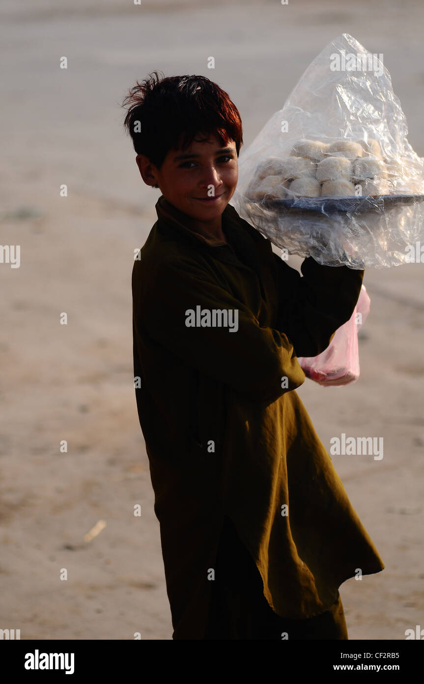 A boy selling food in the vegetable market Stock Photo - Alamy