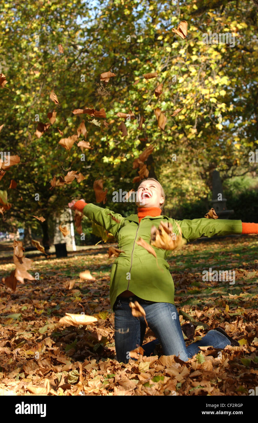 Female blonde hair off face wearing lime green jacket over orange ...