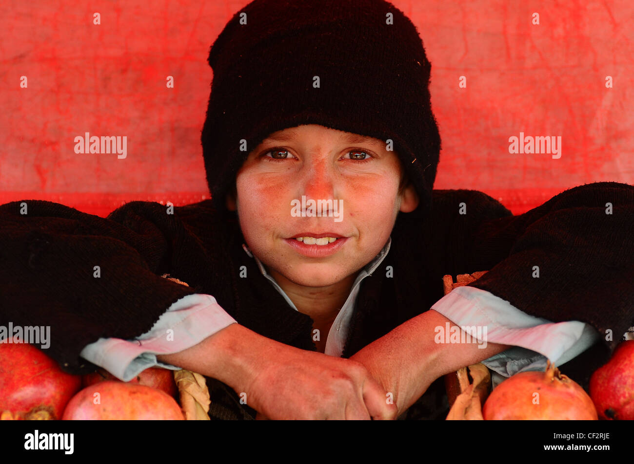A little boy working at the subzi mandi (fruit and vegetable market) in ...