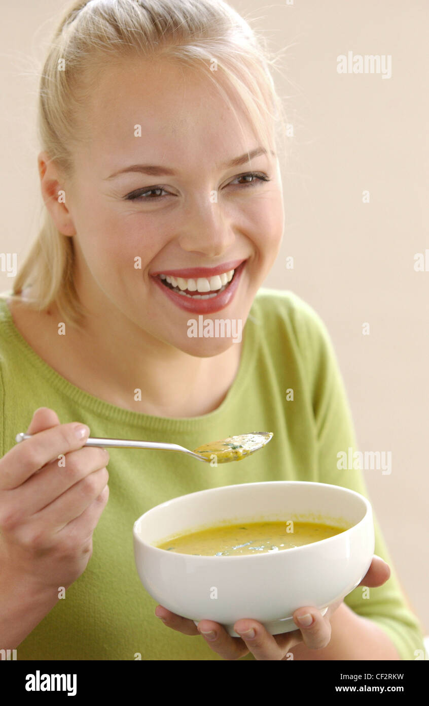 Female blonde hair up strands of fringe over forehead wearing olive ...