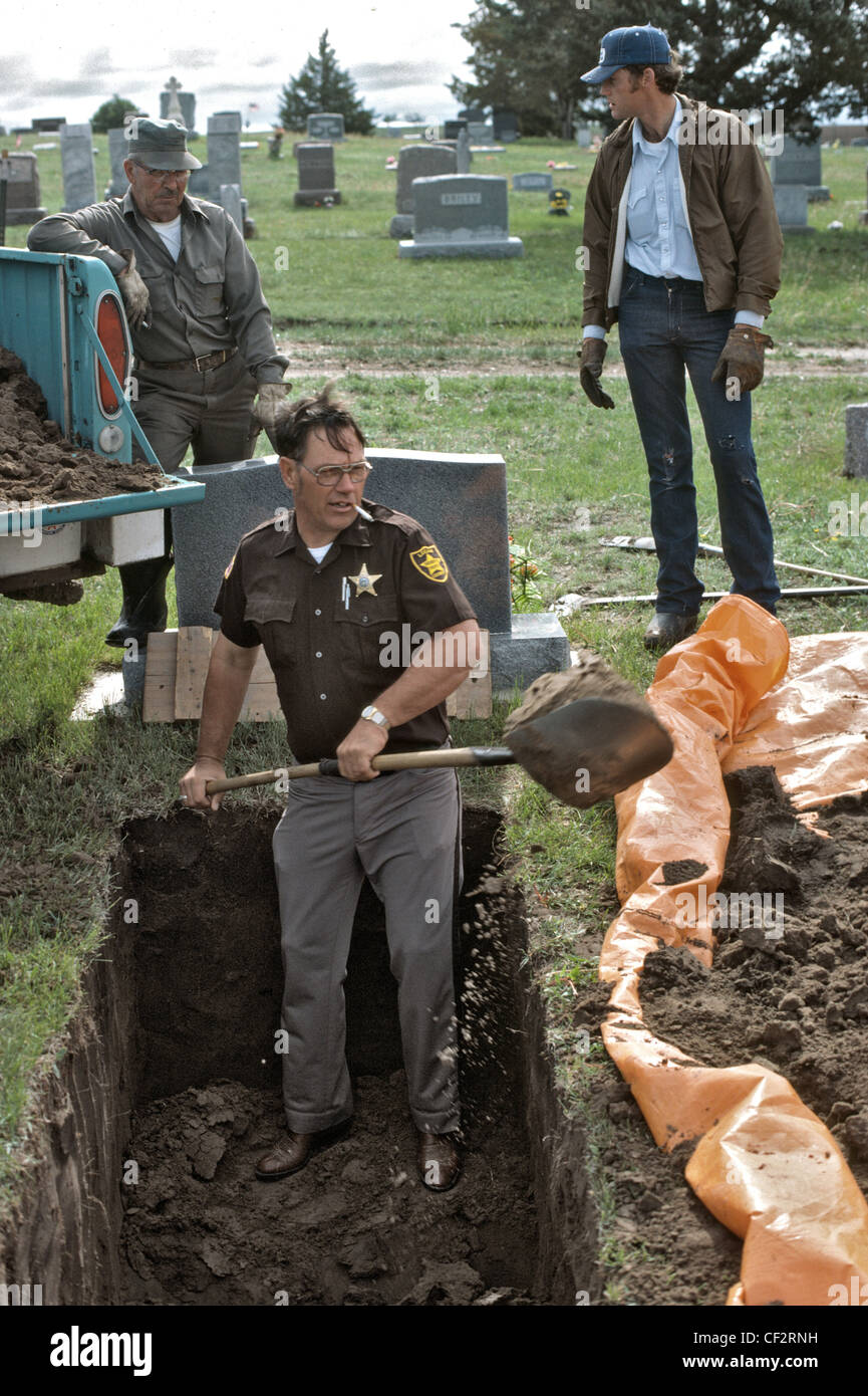 American cemetery with marshal with badge digging out a grave Stock ...