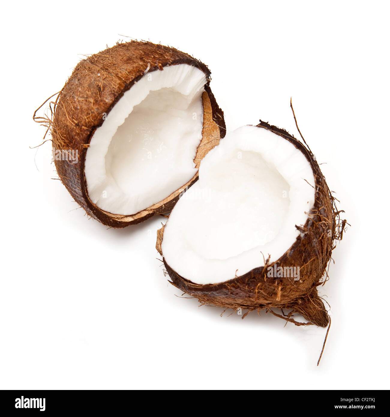 Coconut halved and isolated on a white studio background Stock Photo ...