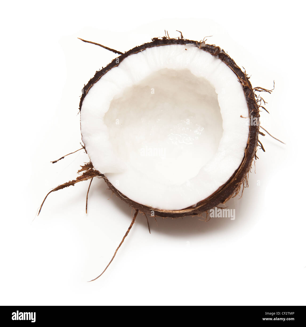 Coconut halved and isolated on a white studio background Stock Photo ...