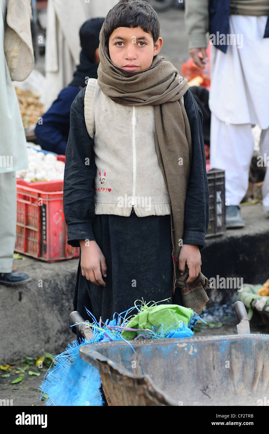 A little boy working in subzi mandi (vegetable market) in Islamabad ...