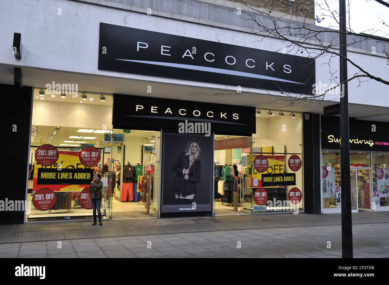 A general view of Peacocks store shop front window with sale signs on ...