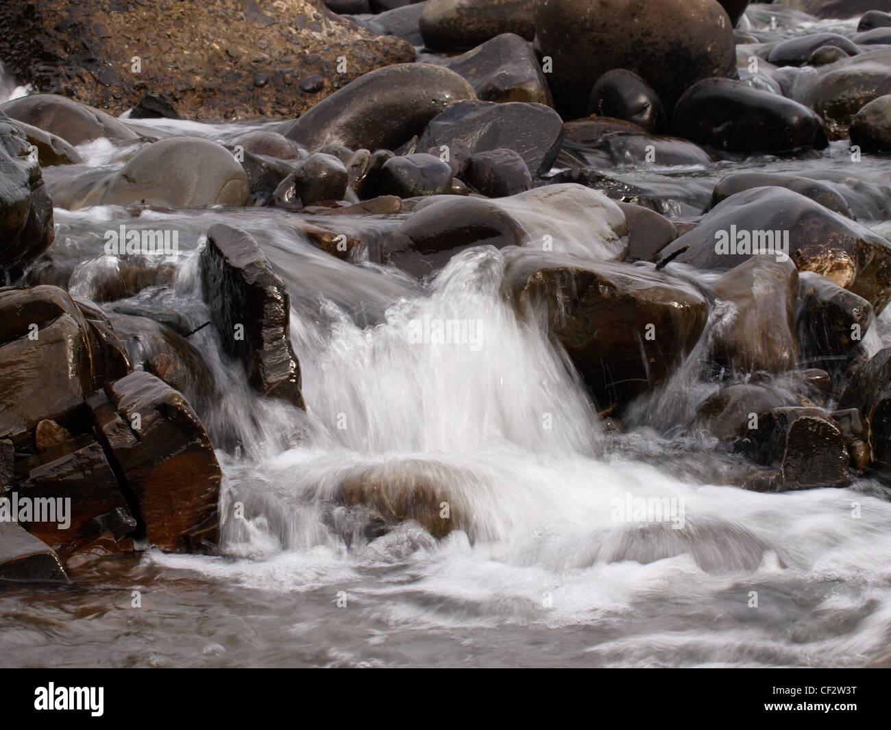 Water over rocks, Cornwall, UK Stock Photo - Alamy