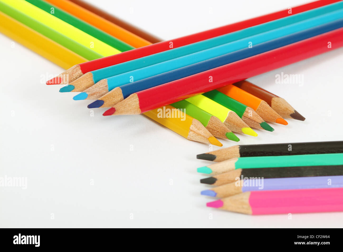 aranged wooden color pens on white background Stock Photo - Alamy