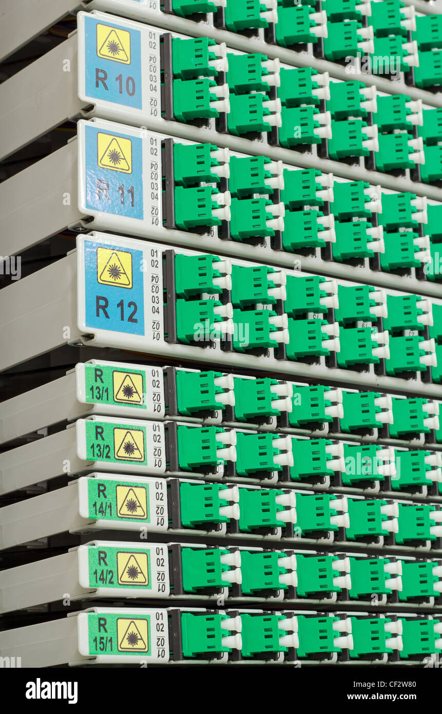 fiber optic cable management system with green and blue SC connectors ...