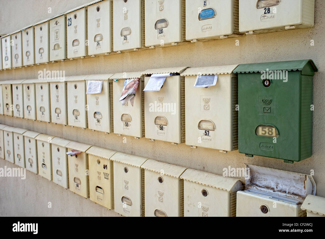 mailboxes on a wall Stock Photo - Alamy