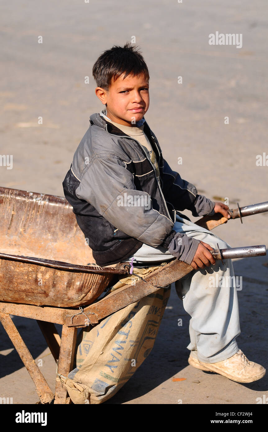 I little boy working in the subzi mandi (vegetable market) in Islamabad ...