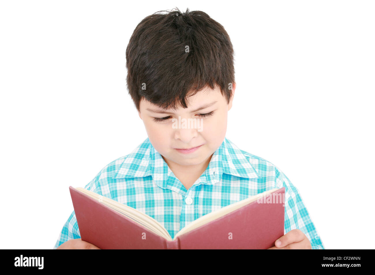 Small boy reading a book on a white background Stock Photo - Alamy