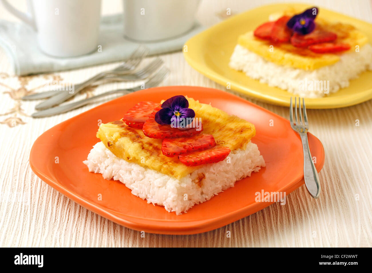 Rice with coconut and fruits. Recipe available Stock Photo - Alamy
