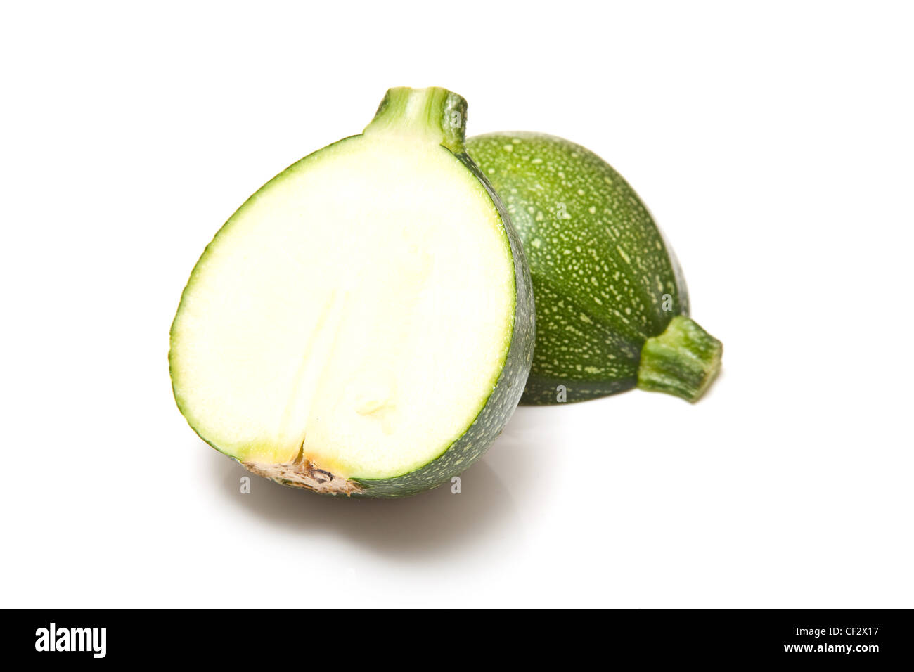 Globe courgette or zucchini isolated on a white studio background Stock ...