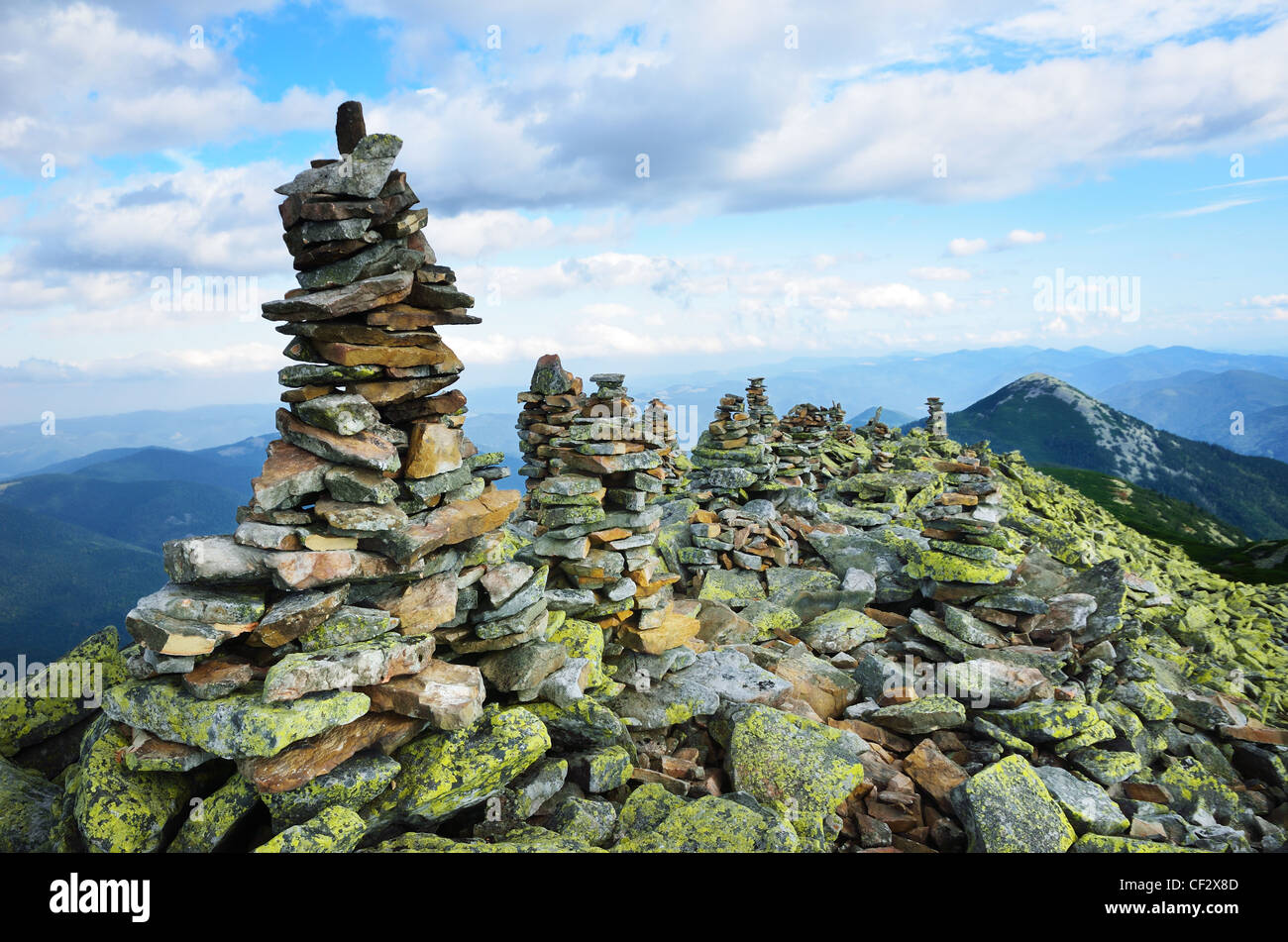 Peak of mountain with moraine and stone landmarks Stock Photo - Alamy
