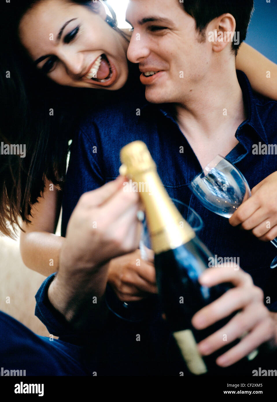 Female long brunette hair holding two wine glasses flinging her arms ...