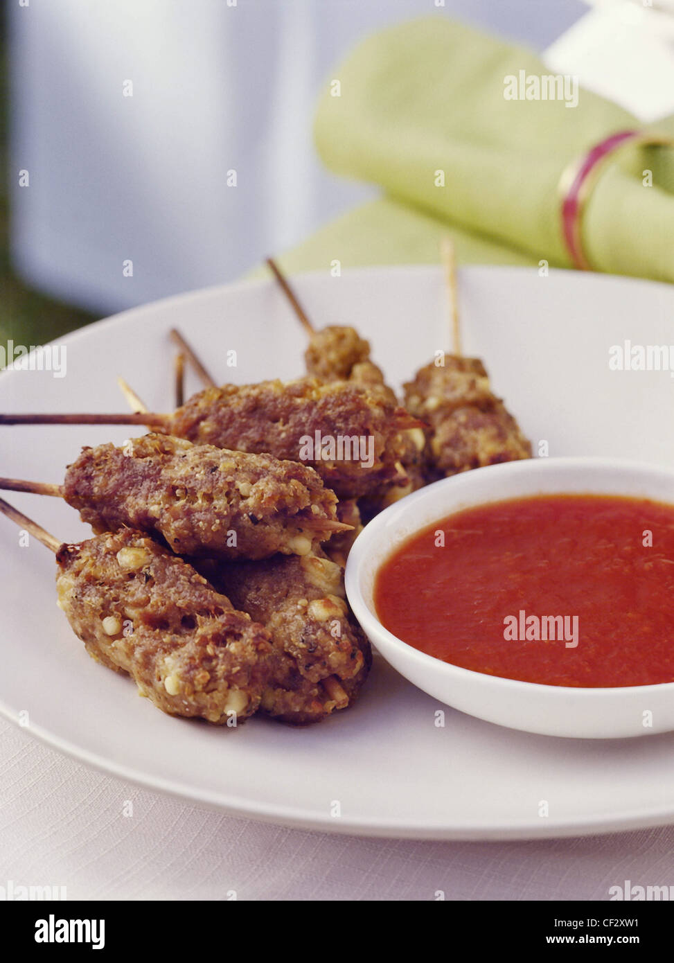 "Cocktail party" Baked spicy lamb kebabs with tomato relish Stock Photo ...
