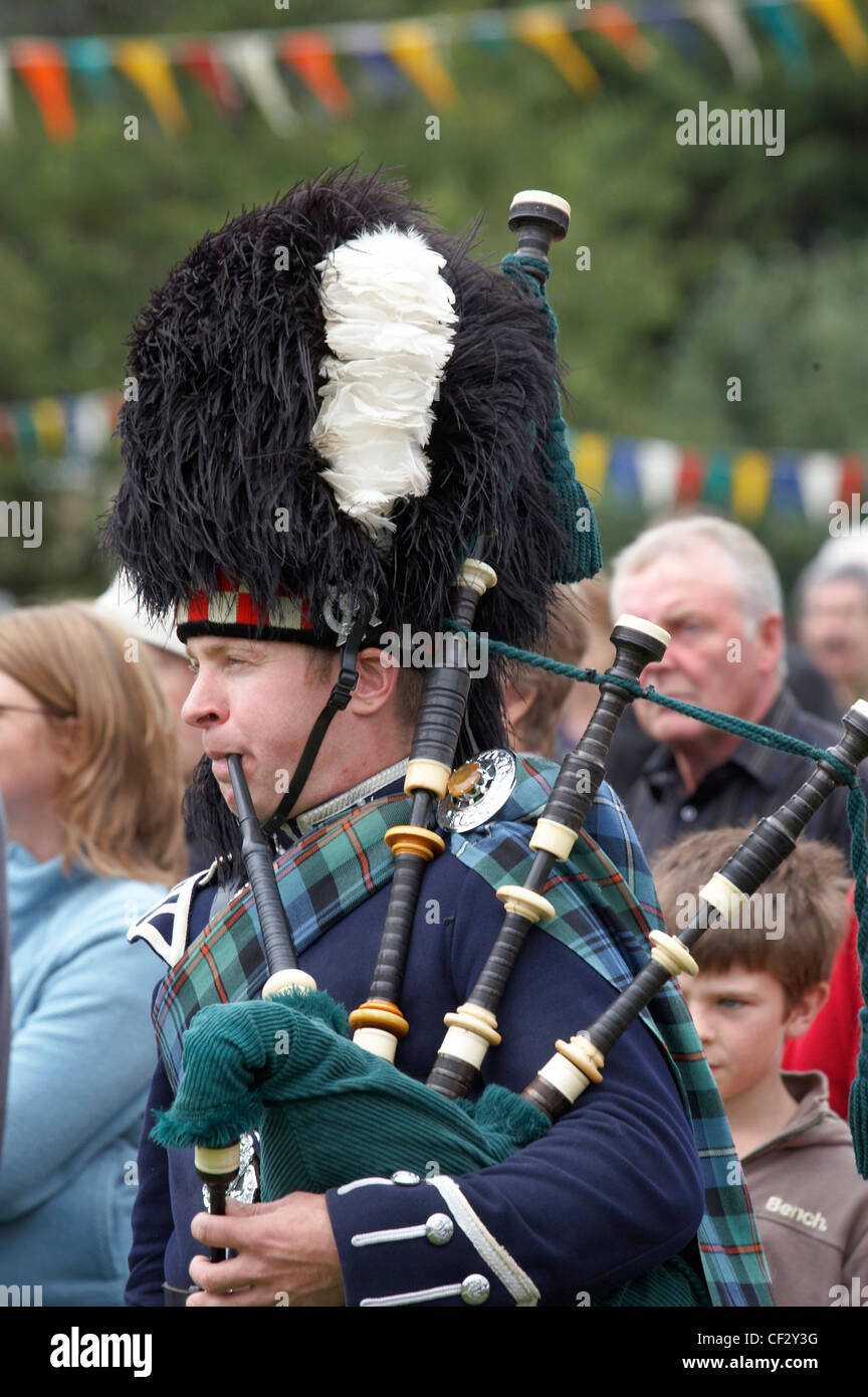 A piper at the Lonach Gathering and Highland Games, (billed as ‚Äö√Ñ√≤ ...