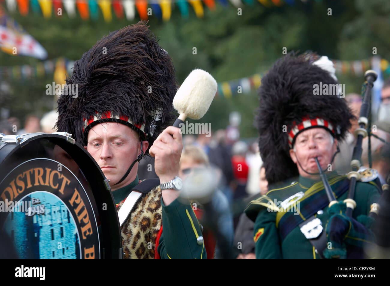 A marching pipe band at the Lonach Gathering and Highland Games ...
