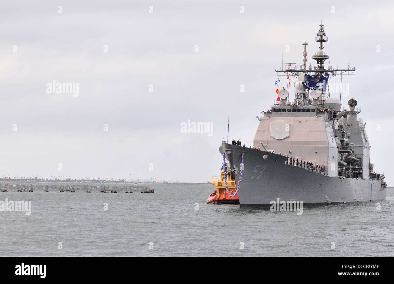 The guided-missile cruiser USS Mobile Bay arrives to its homeport at ...