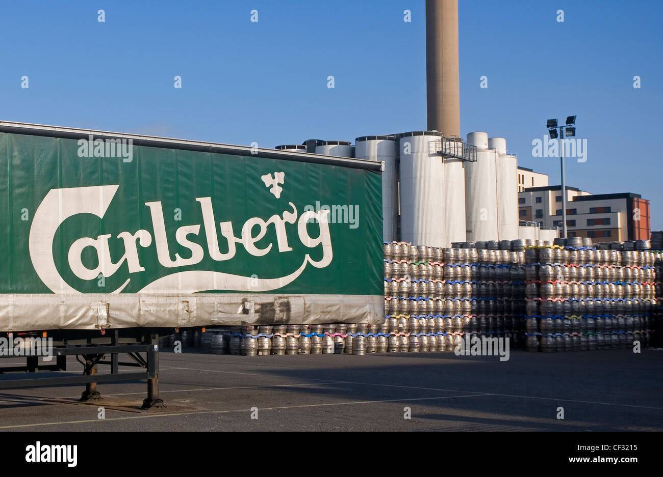 Beer kegs stacked outside the Carlsberg Tetley brewery ready to be ...