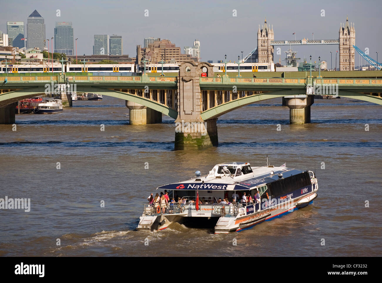 A Thames Clipper boat heading east towards the City of London ...