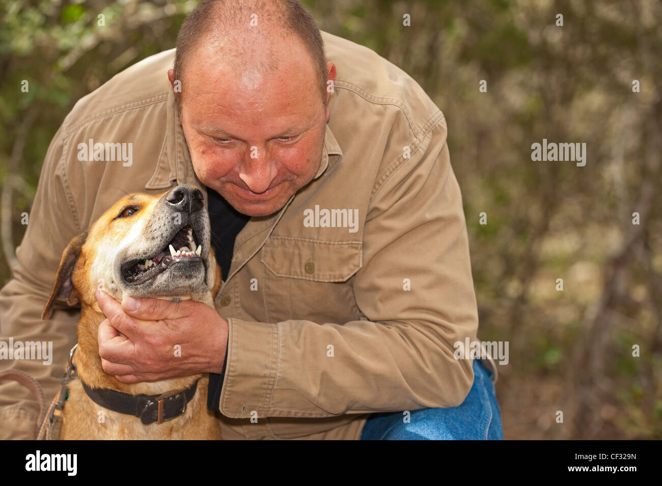 Dog man old cuddle hi-res stock photography and images - Alamy