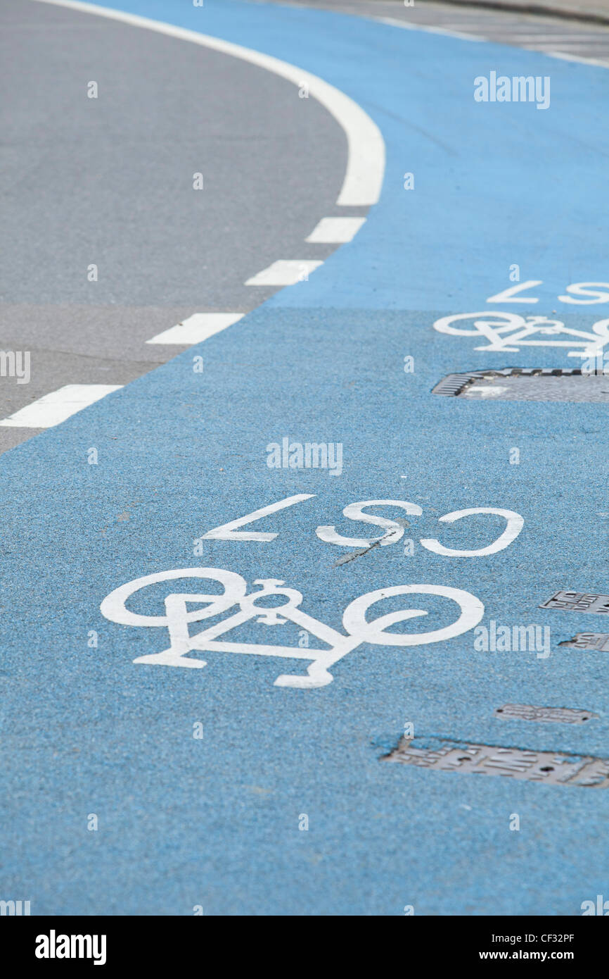 A view of a blue cycling lane marked on the streets of the London ...