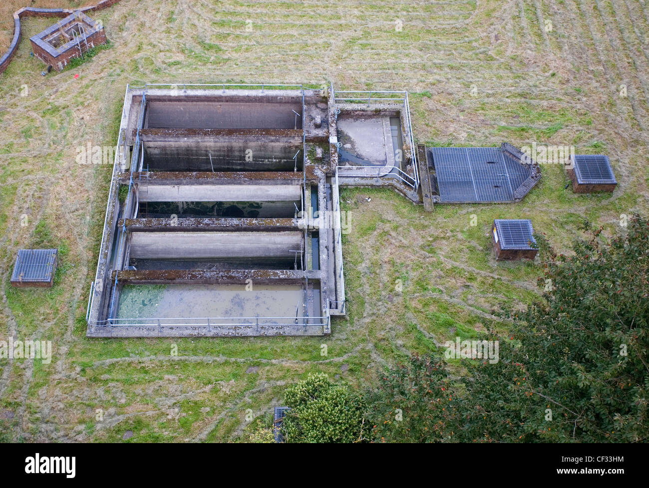 Settling tanks at a sewage treatment works, viewed from the ...