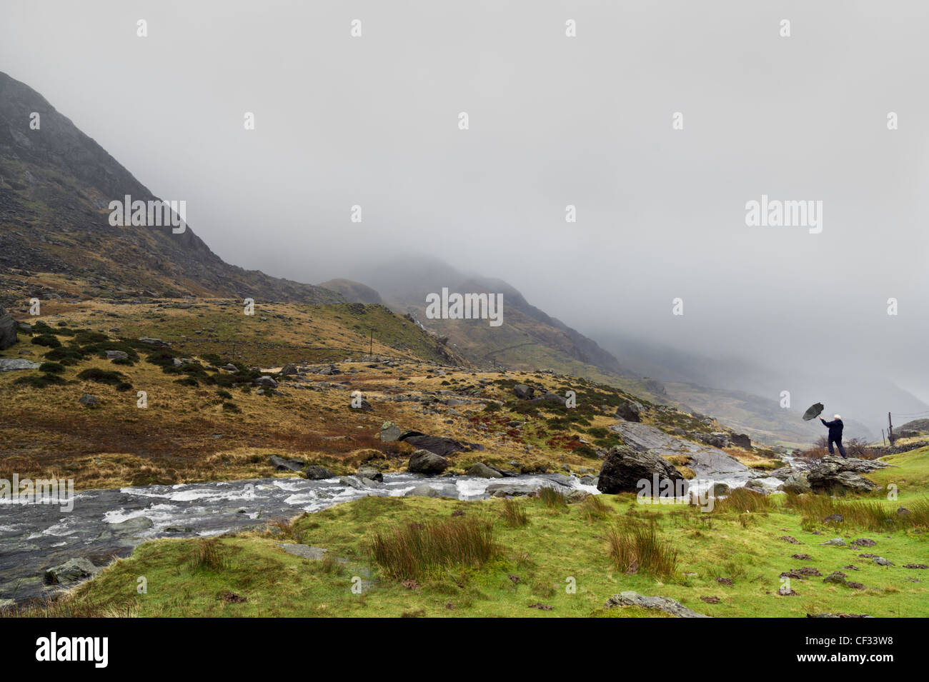 Battling the elements beside the afon or nant (river) peris at the top ...
