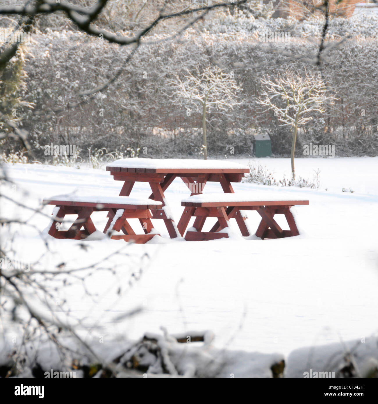 Winter Snow scene picnic table and seats in house back garden covered ...