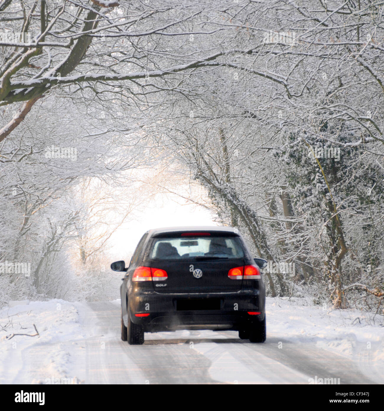 Winter weather wonderland VW Volkswagen Golf car driving on snow & ice ...