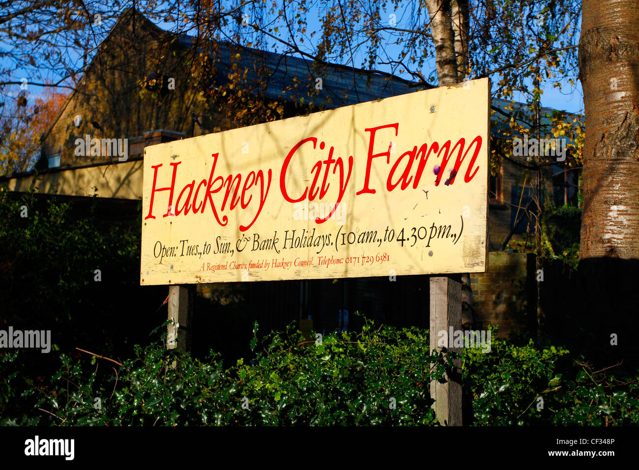 Hackney City Farm sign displaying opening times. Hackney City Farm is a ...