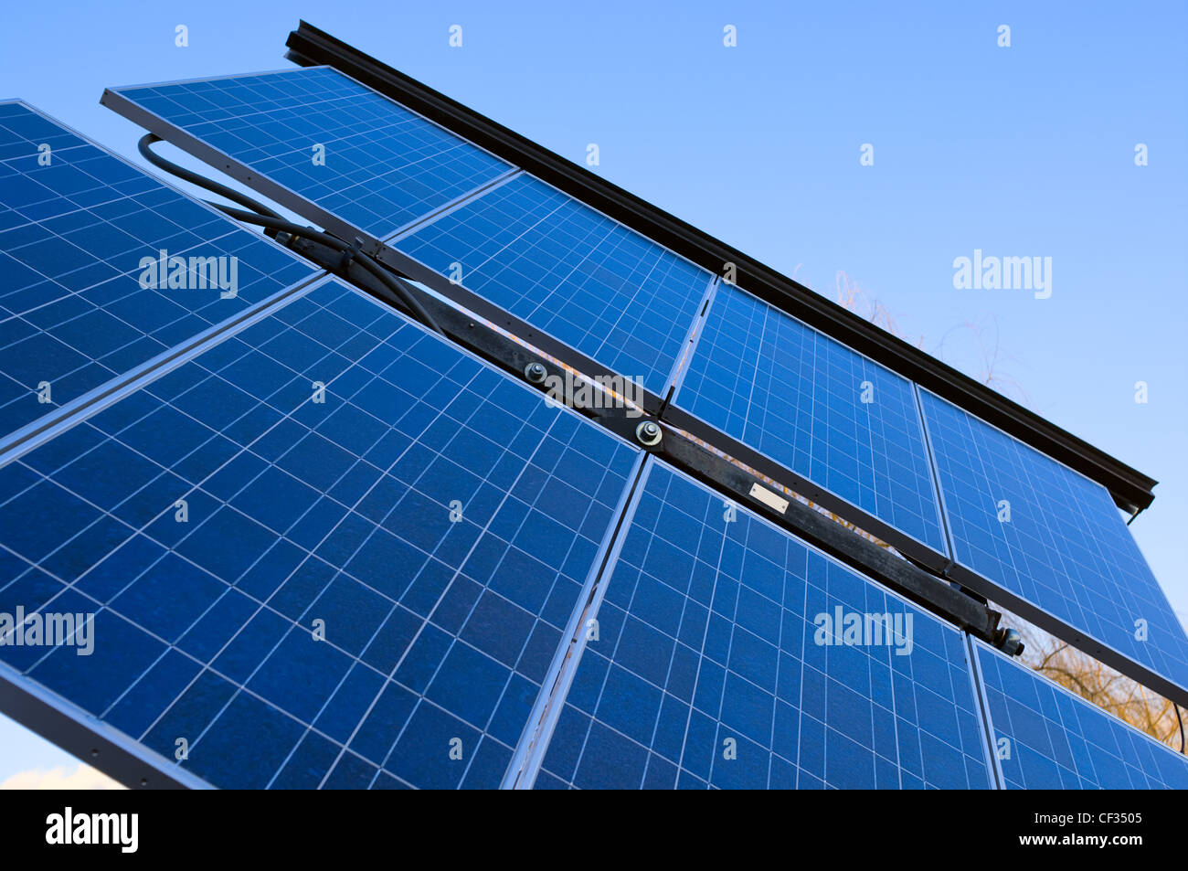 Closeup of photovoltaic solar panel array against blue sky Stock Photo ...
