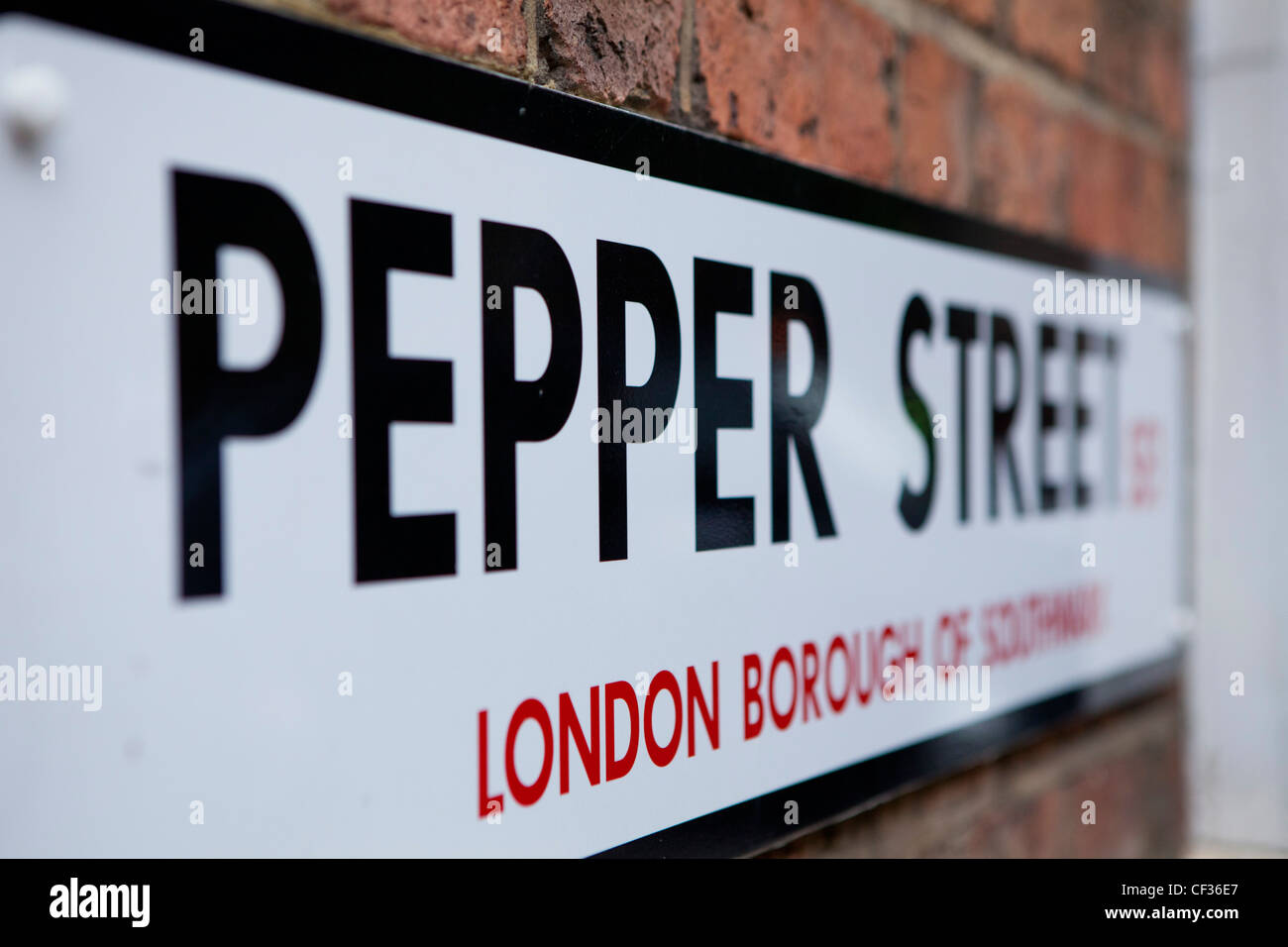 A view of a road sign for Pepper Street in the London Borough of ...
