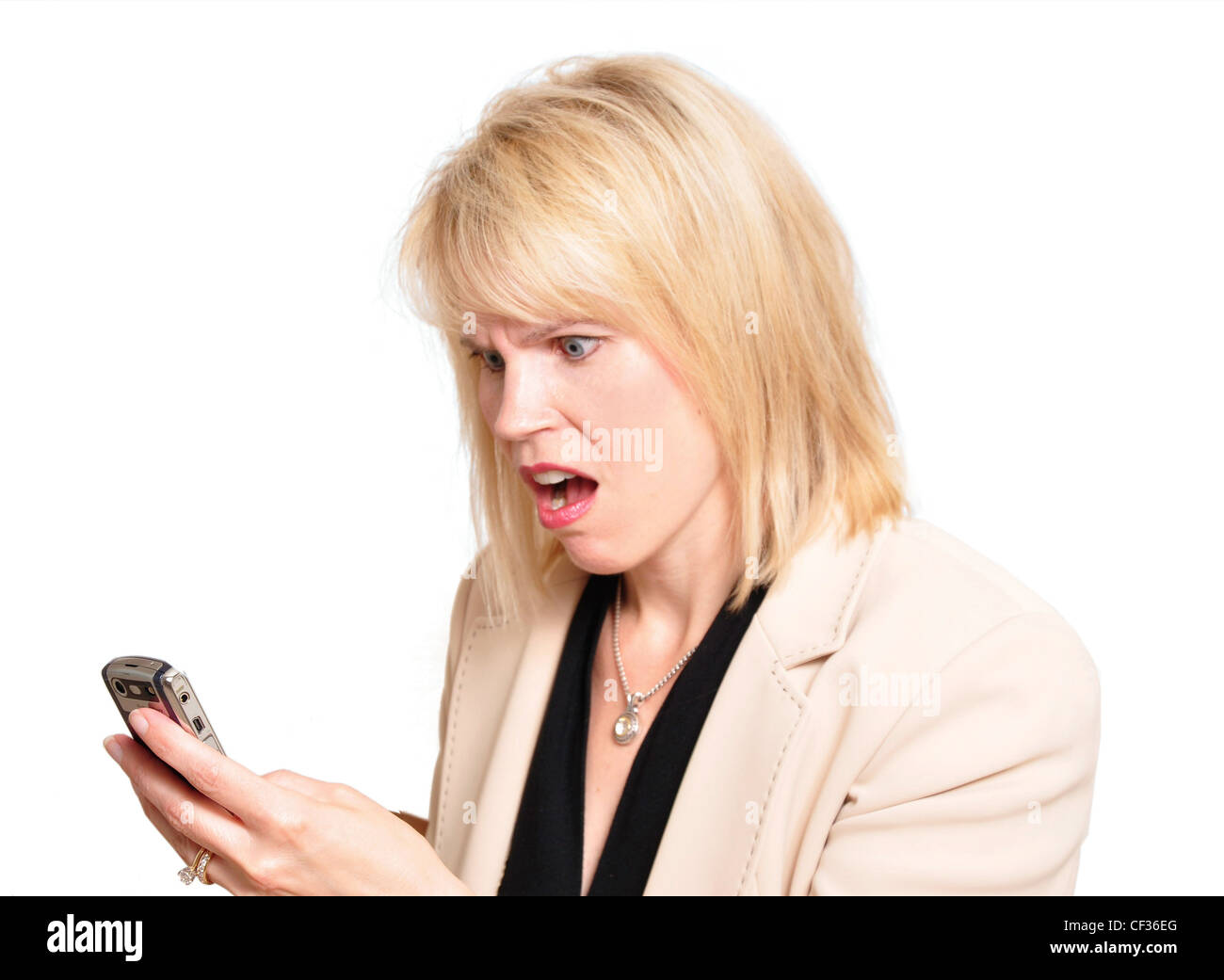 Working businesswoman receiving shocking news Stock Photo - Alamy