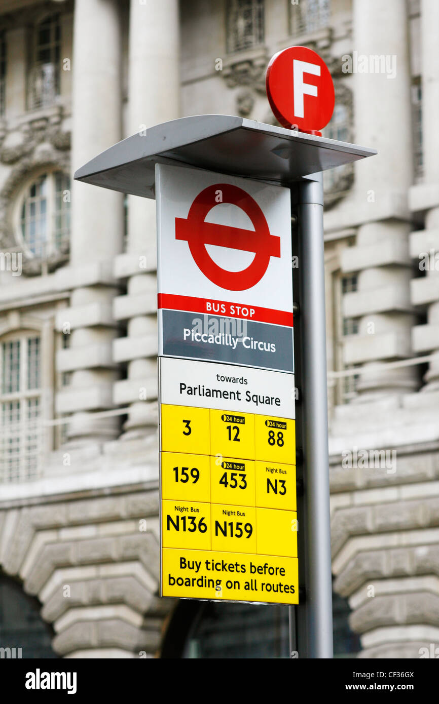 Bus stop sign at Piccadilly Circus in London Stock Photo - Alamy