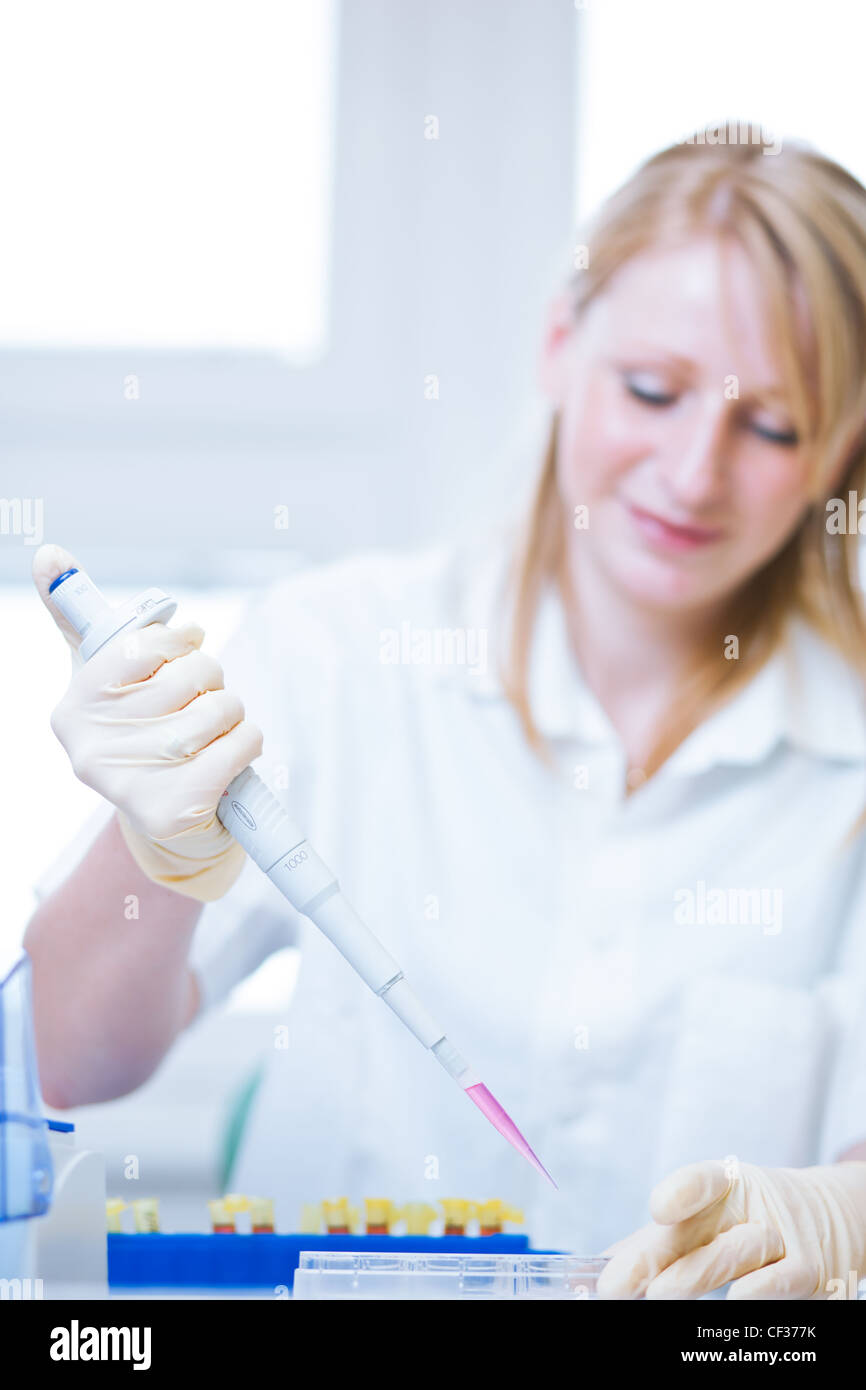 Female researcher doing research in a lab Stock Photo - Alamy