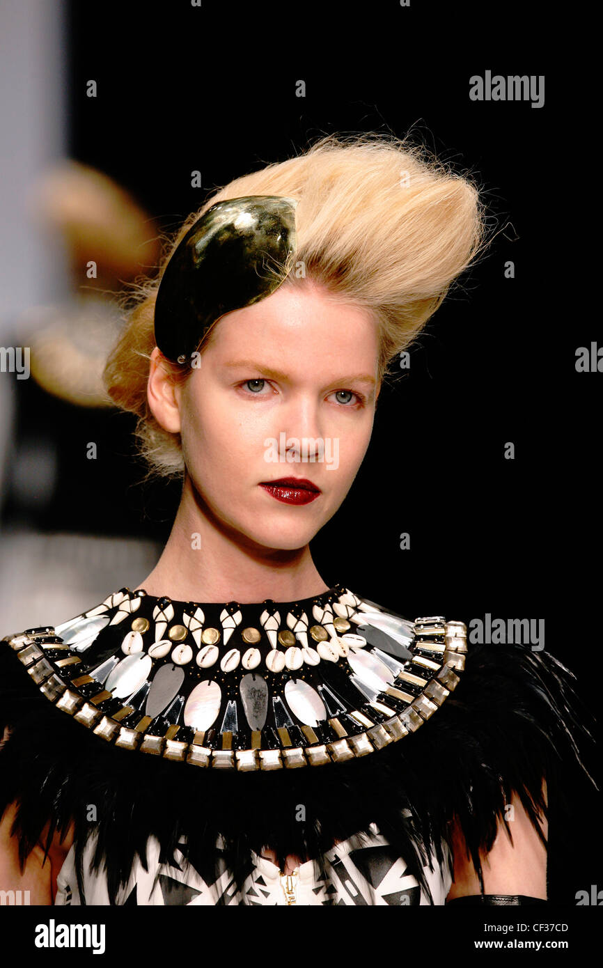 Embellished feathered top and green hair accessory Stock Photo - Alamy