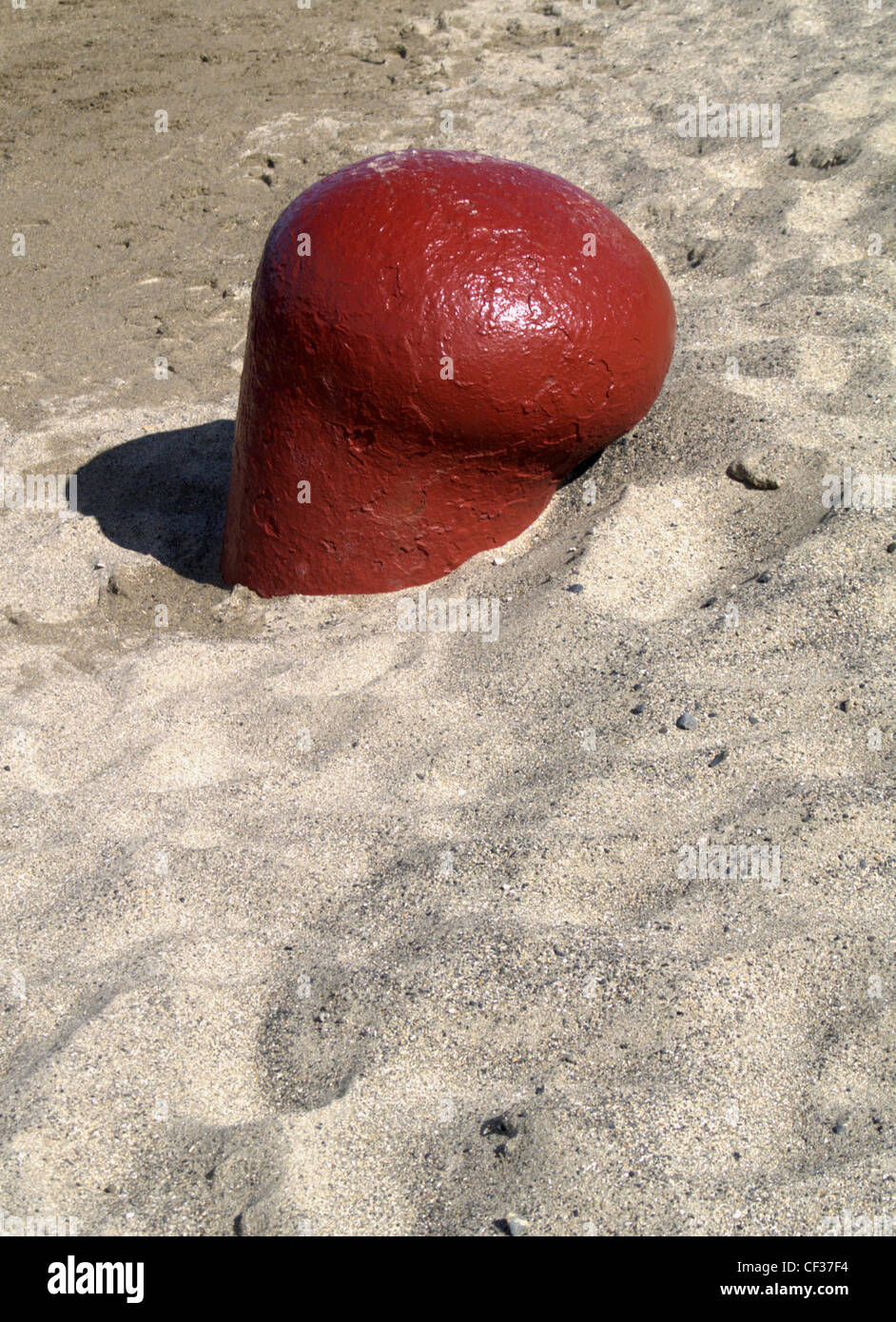 Bollard covered in sand Stock Photo - Alamy