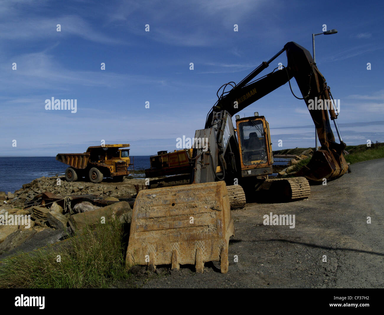 Plant and machinery - earthmoving equipment building a harbour on the ...