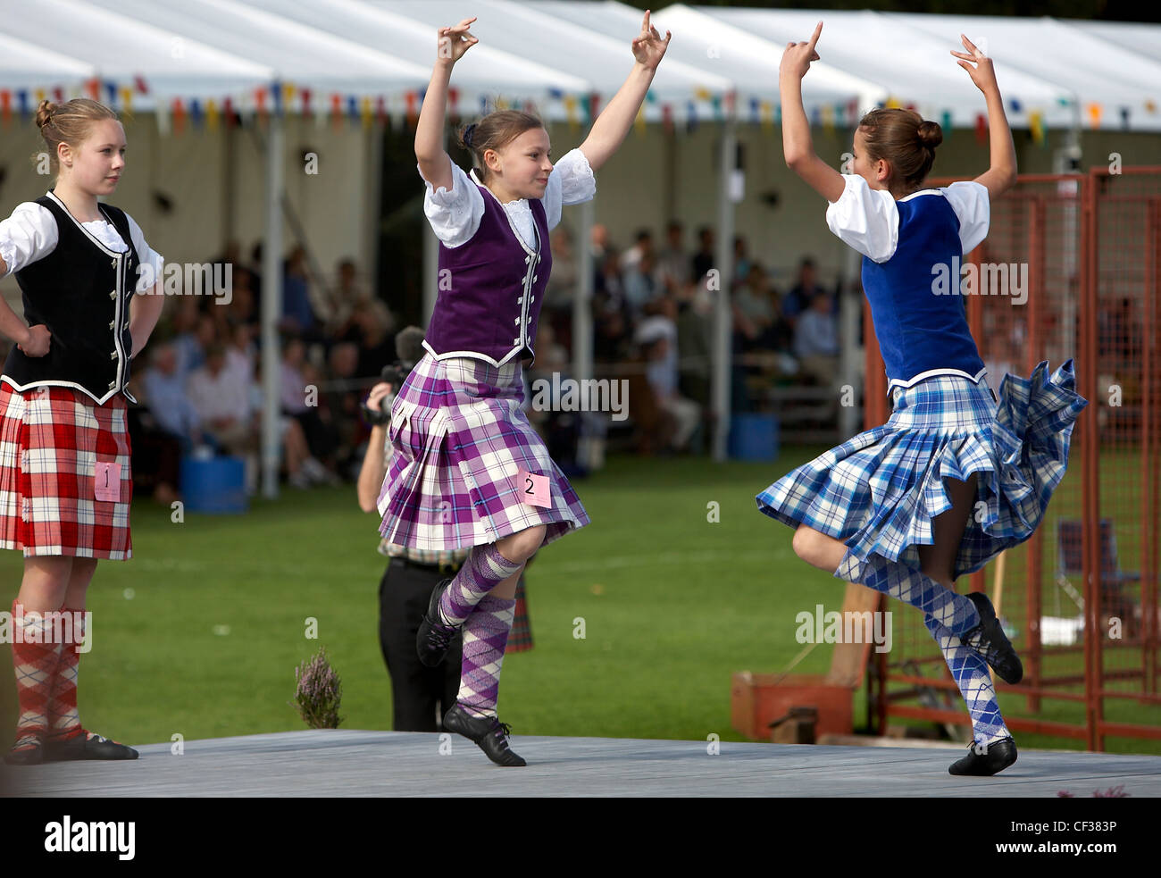 Highland dance girls in competition at the Lonach Highland Games Stock ...