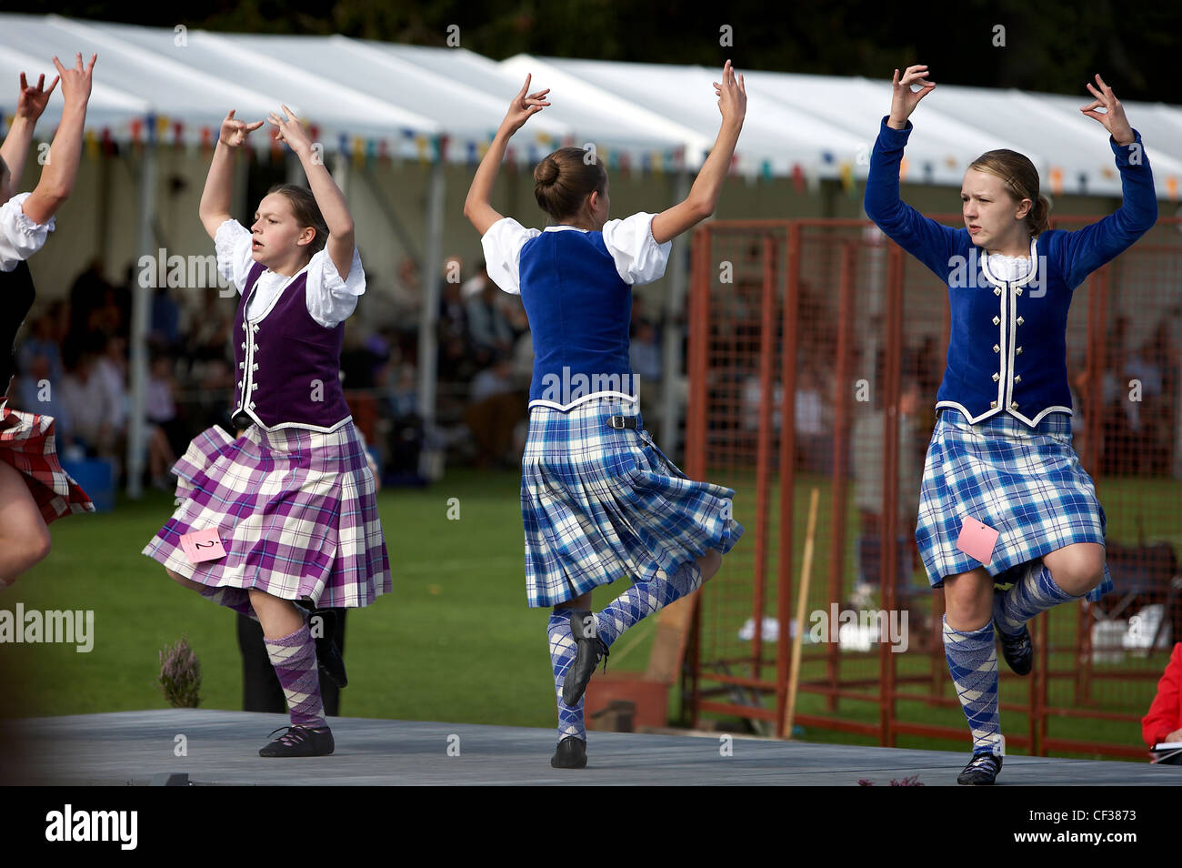 Highland dance girls in competition at the Lonach Highland Games Stock ...