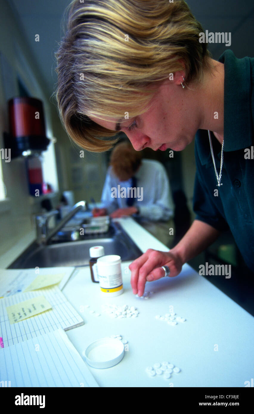 Veterinary nurse preparing dog's medication, Wokingham Training Centre ...