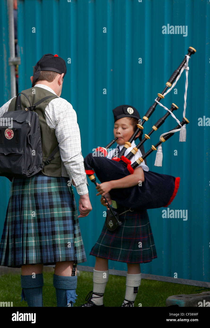 A young piper practising at the Lonach Highland Games Stock Photo - Alamy