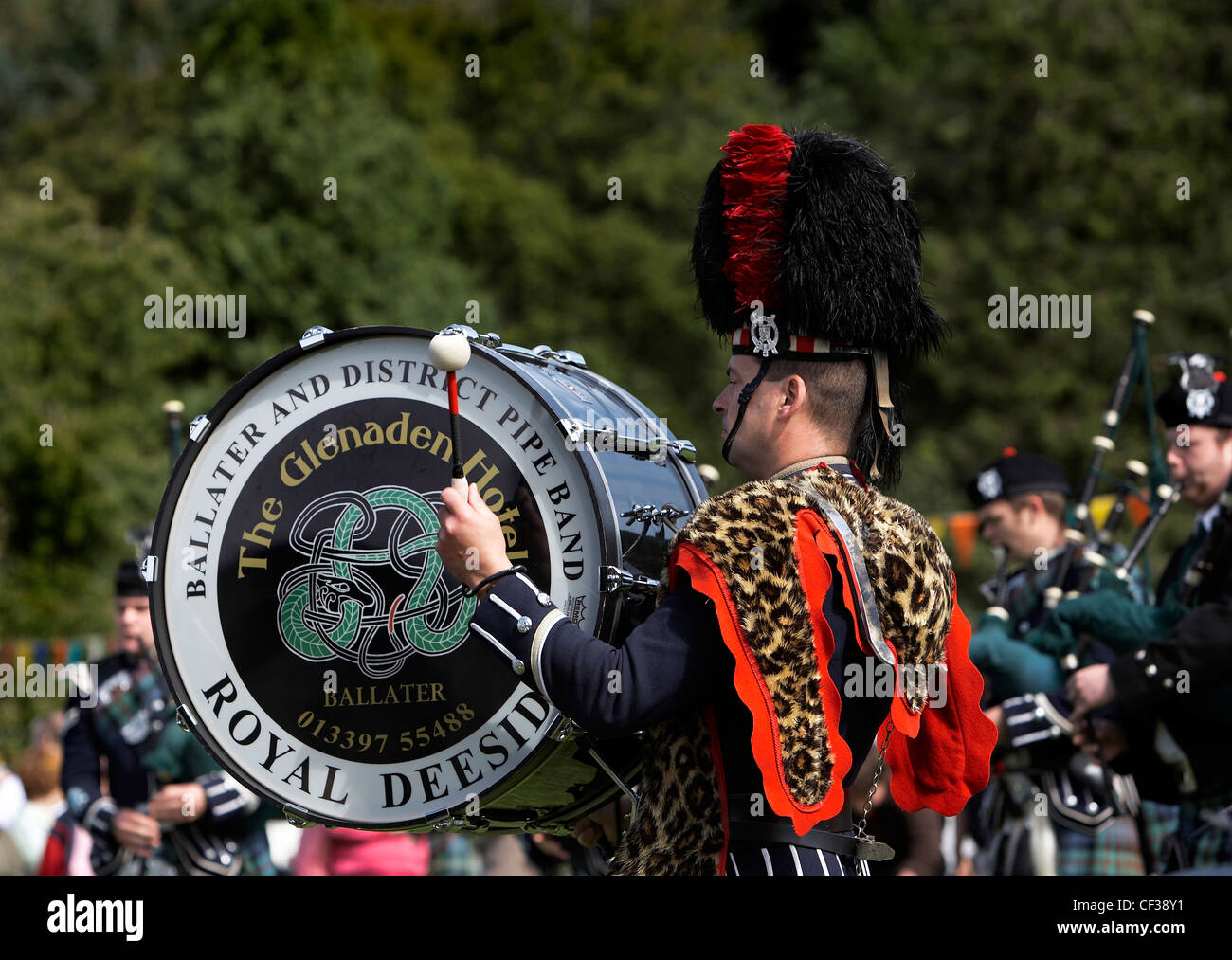 A marching drummer performing at the Lonach Highland Games Stock Photo ...