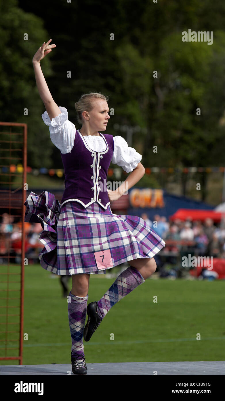A female highland dancer performing at the Lonach Highland Games Stock ...