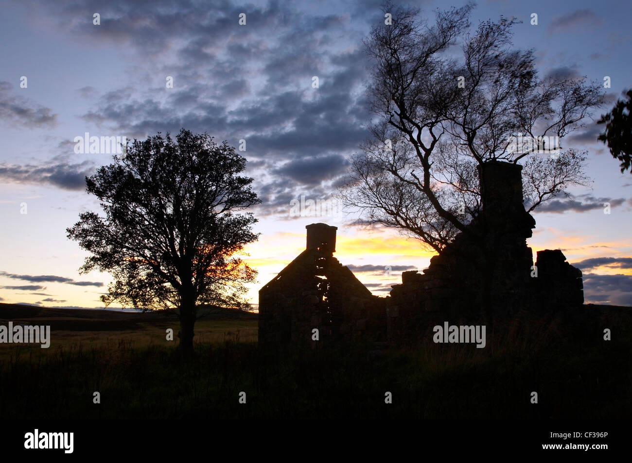 Sunset behind a deserted croft in the Cabrach wilderness of Scotland ...