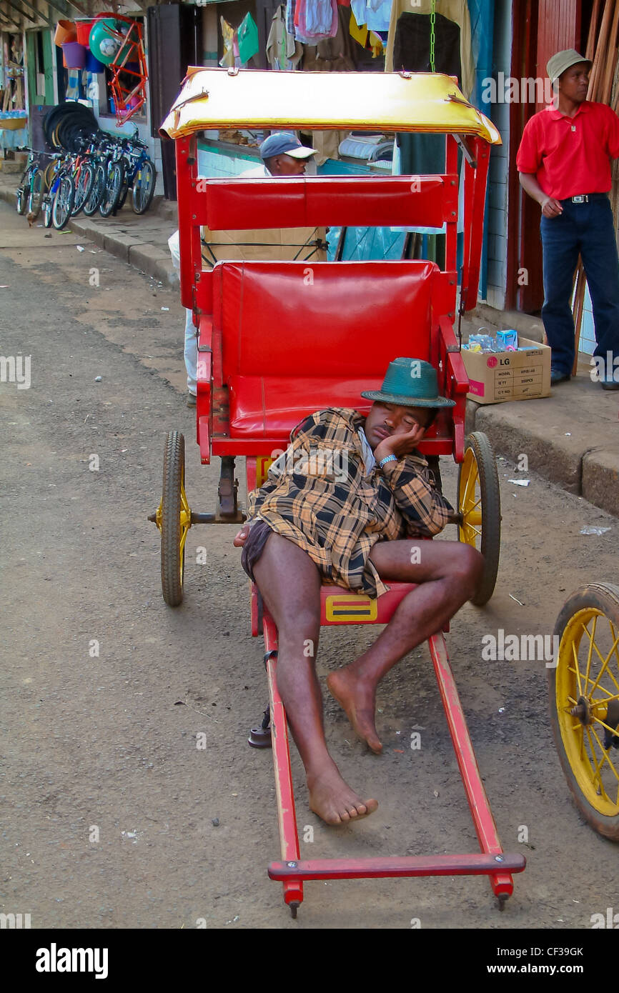 Rickshaw puller in Antsirabe, Madagascar highlands Stock Photo - Alamy