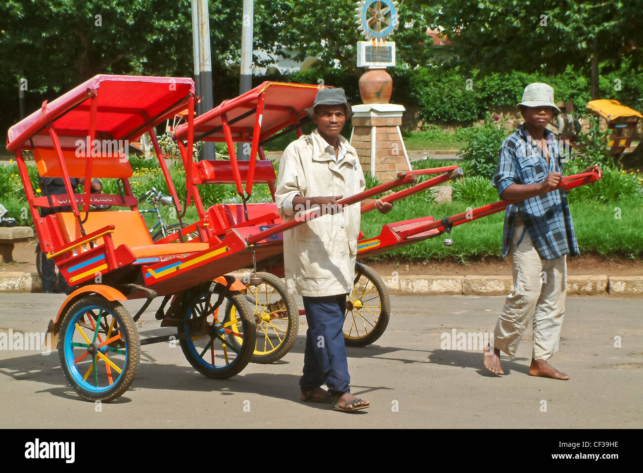 Rickshaw pullers in Antsirabe, Madagascar highlands Stock Photo - Alamy